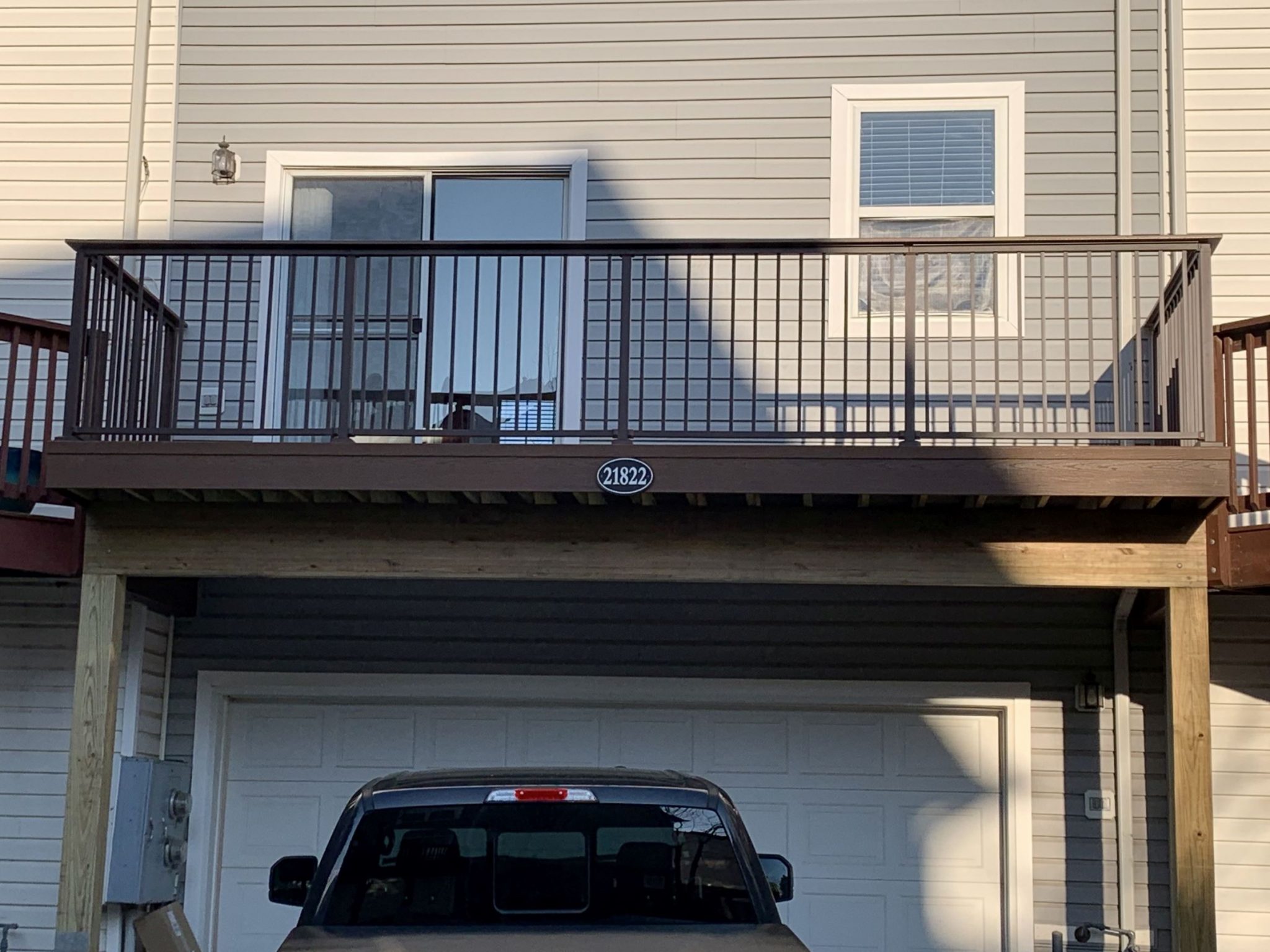 Over Driveway Deck With Brown Composite | http://loudoundeckandfence.com